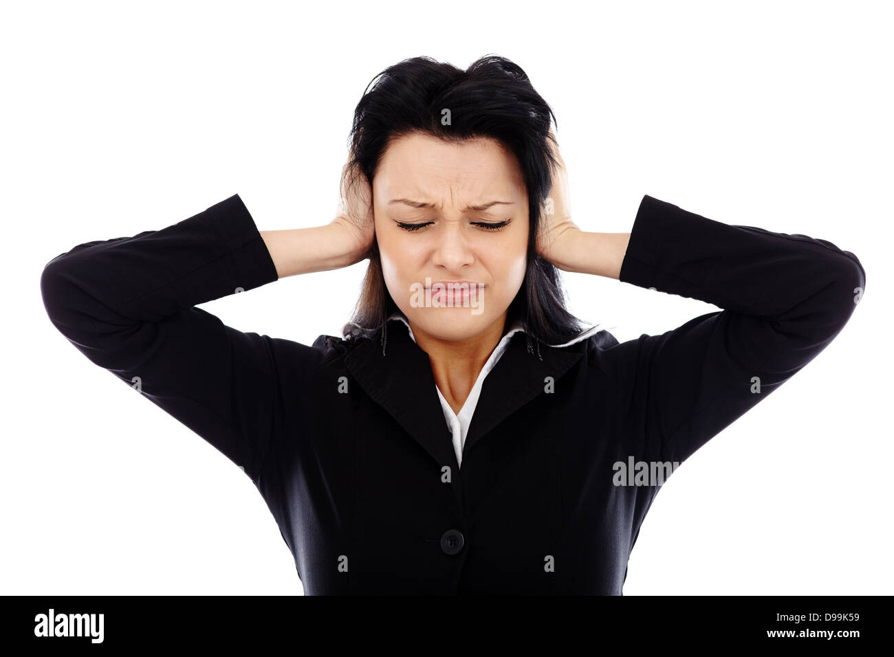 Extremely overworked businesswoman covering her ears in closeup pose ...