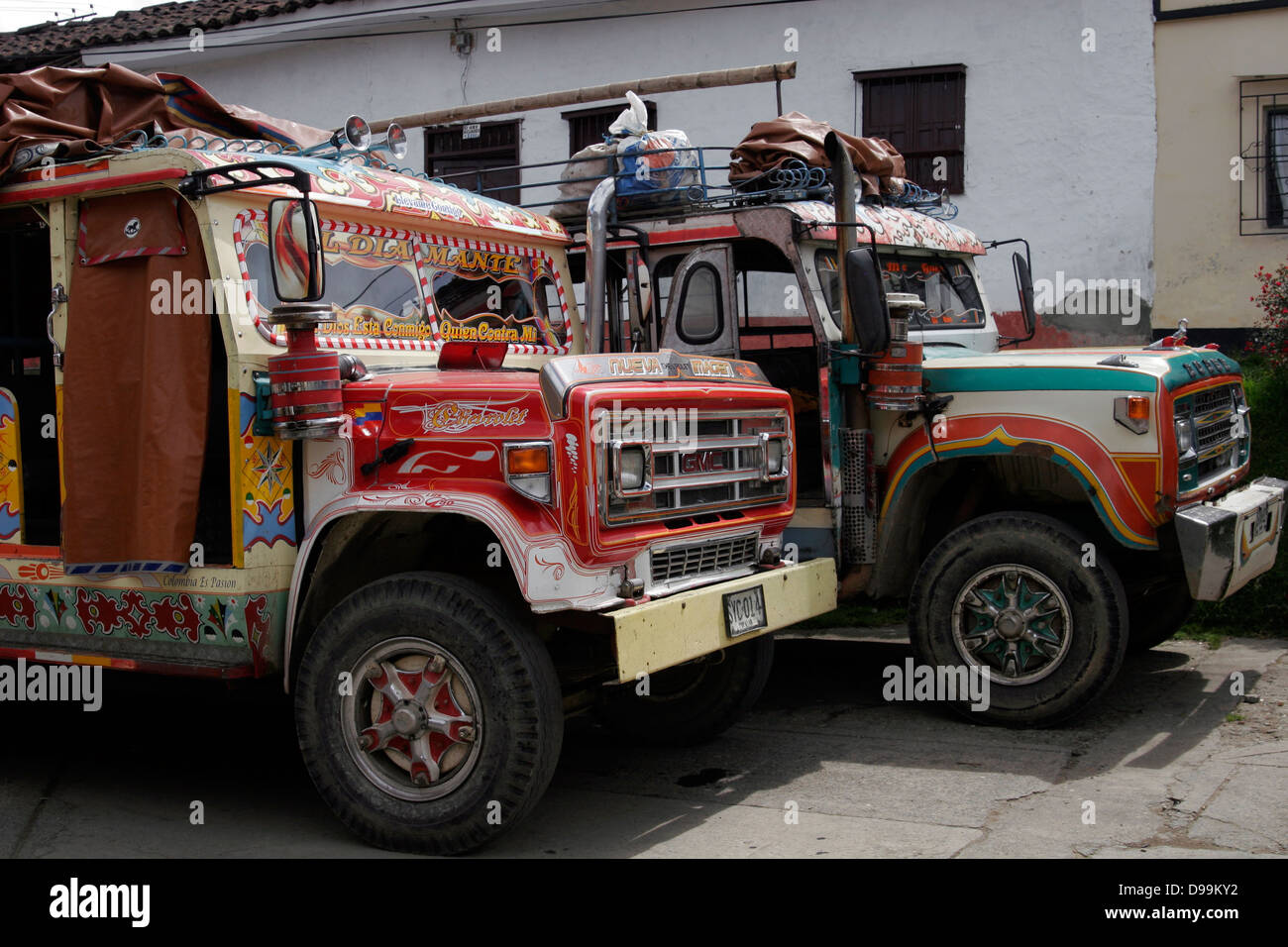 Brightly colored buses used by indigenous Guambiano people in Silvia ...