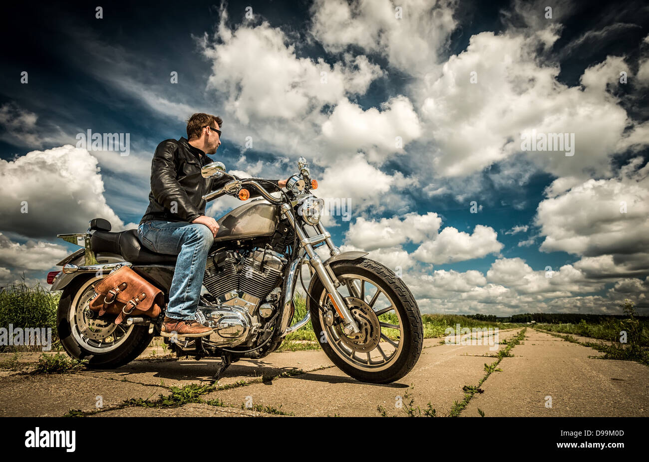 Biker in sunglasses and leather jacket on the road Stock Photo - Alamy