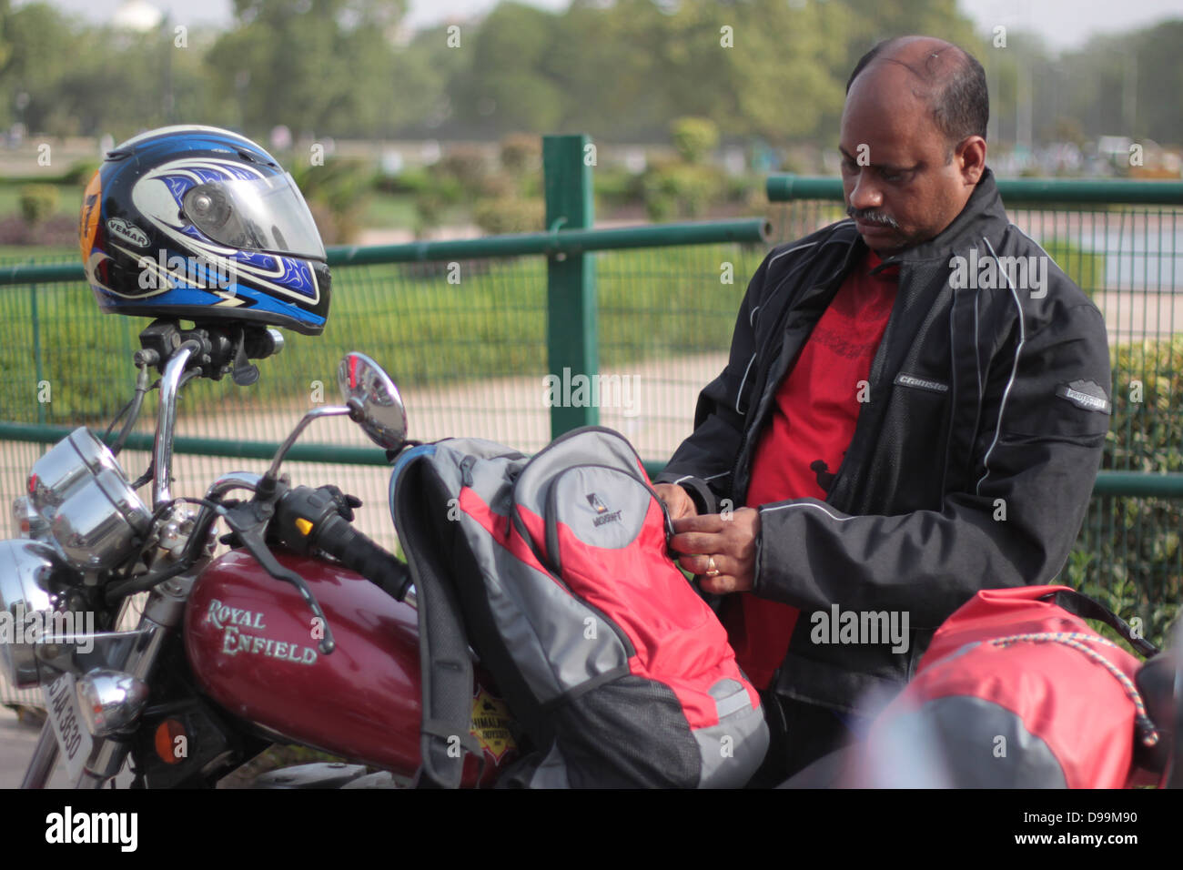 An Indian biker prepares himself for the Himalayan Odyssey biking ...