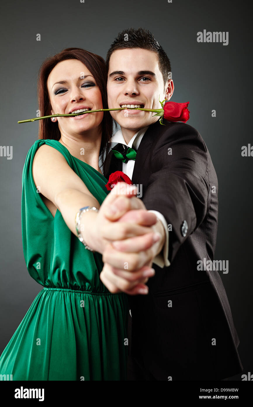 Beautiful Young Couple Dancing Tango And Holding A Rose In Their Teeth Valentine Concept Stock