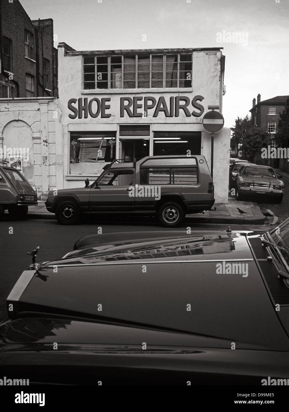 Rolls Royce and shoe repair shop on Brecknock Avenue, London Borough of ...
