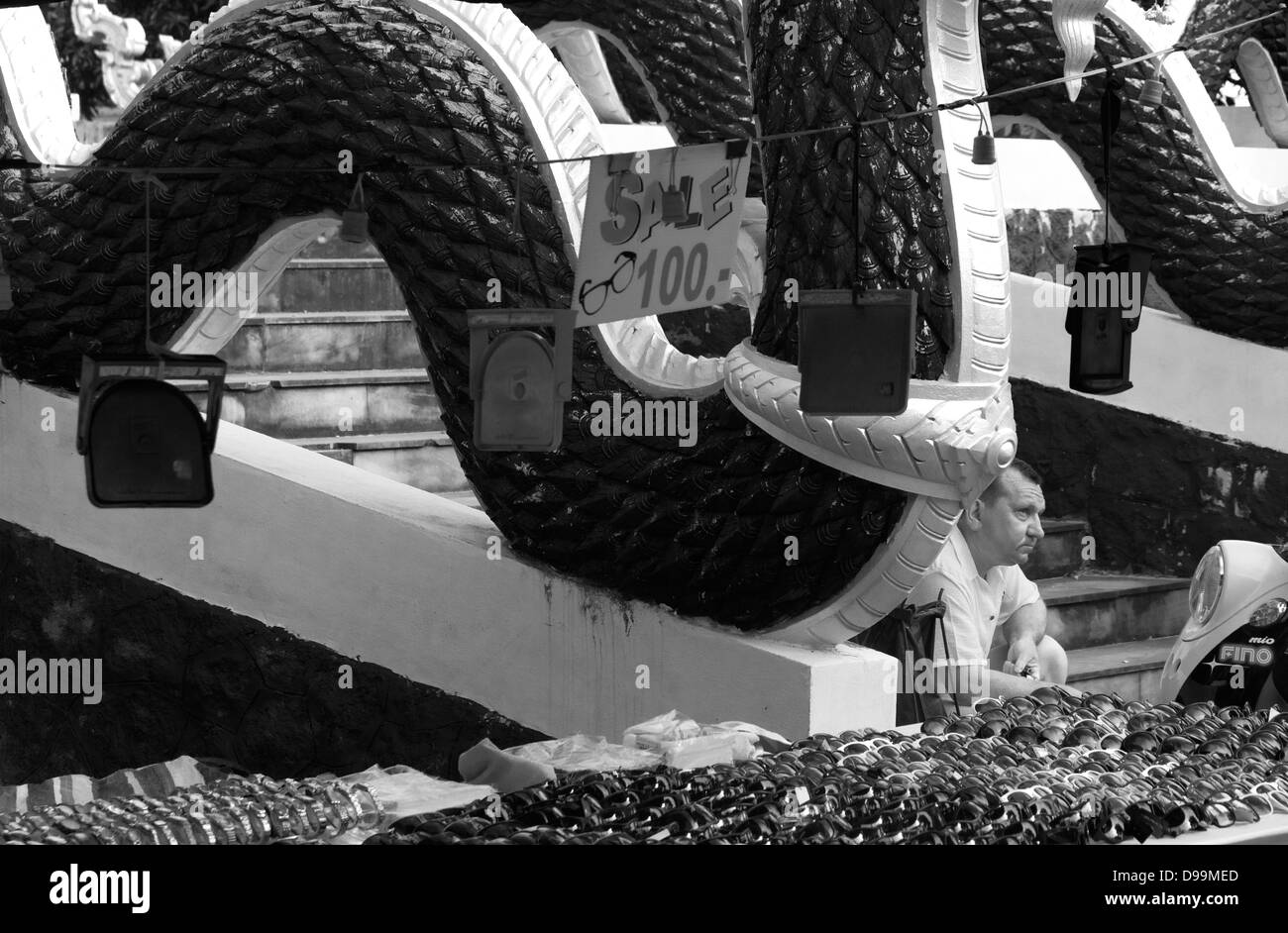 WAT KARON MARKET, KARON, PHUKET, THAILAND FEBRUARY 9 2013: Tourist sits ...