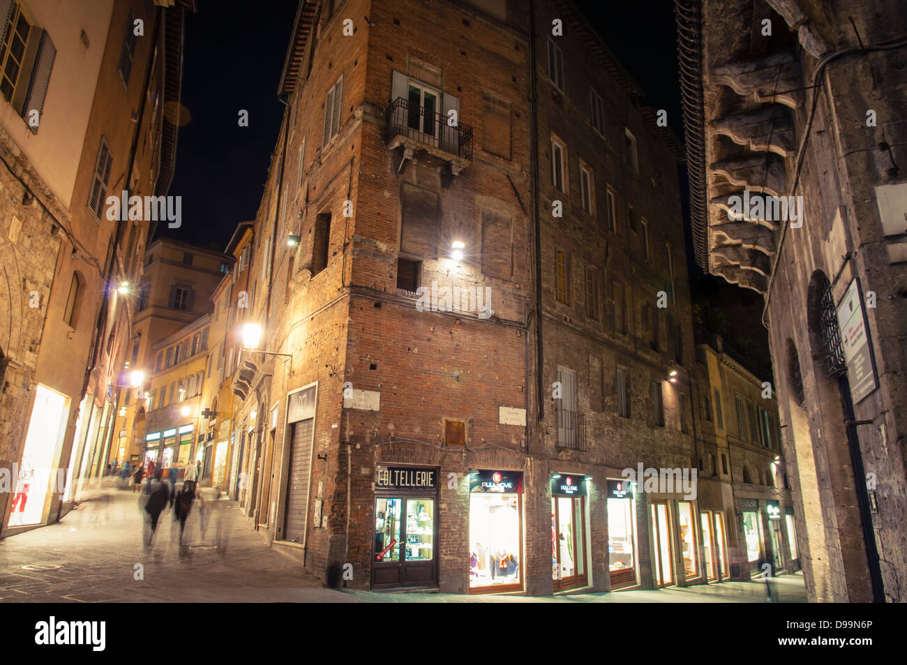 Night time street scene in Siena, Italy Stock Photo - Alamy