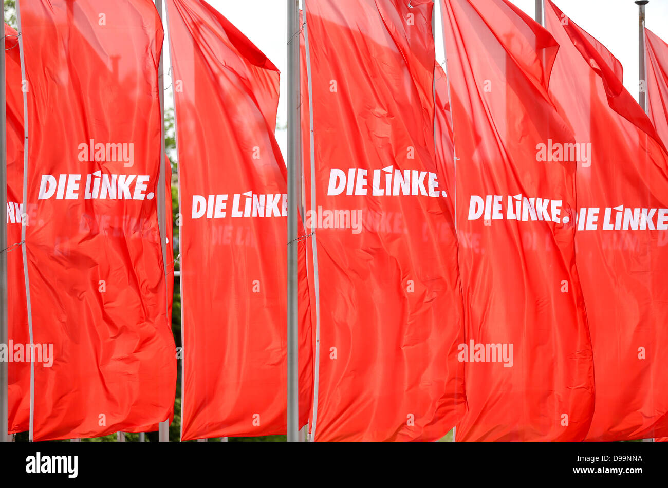 Flags with the logo of The Left Party wave in the wind outside of the ...