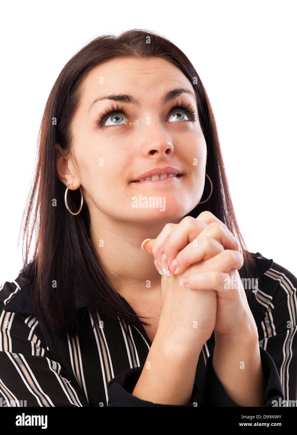 Closeup portrait of a young businesswoman praying while looking up ...