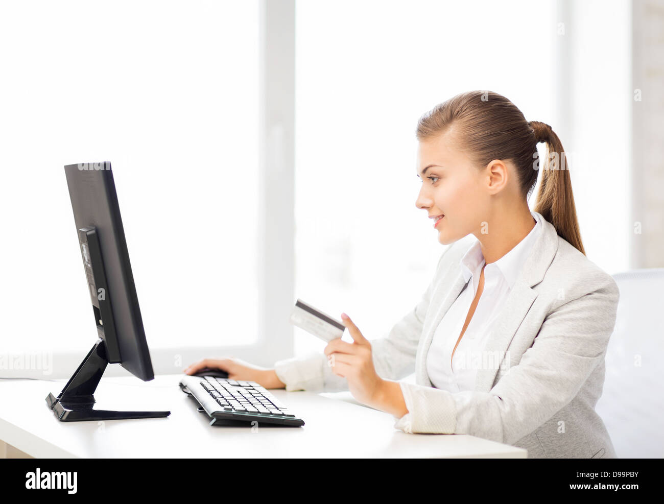 businesswoman with computer using credit card Stock Photo - Alamy