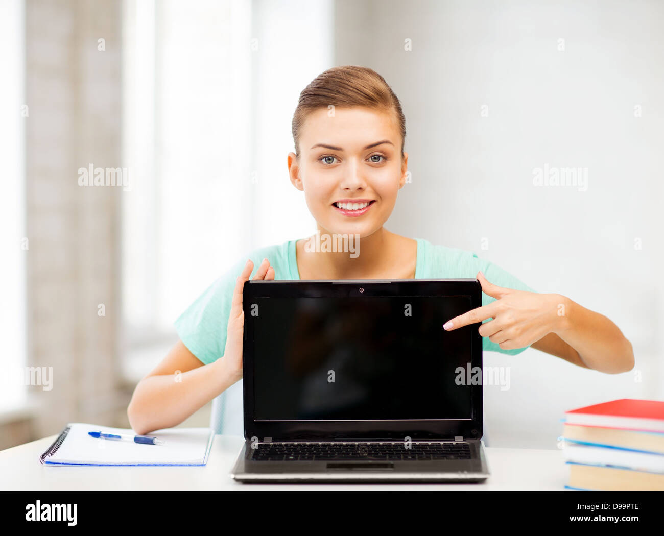 smiling student girl with laptop at school Stock Photo - Alamy