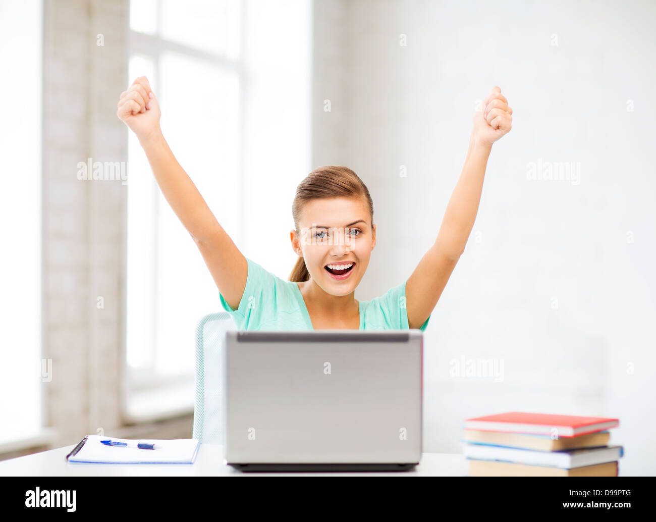 happy student girl with laptop at school Stock Photo - Alamy