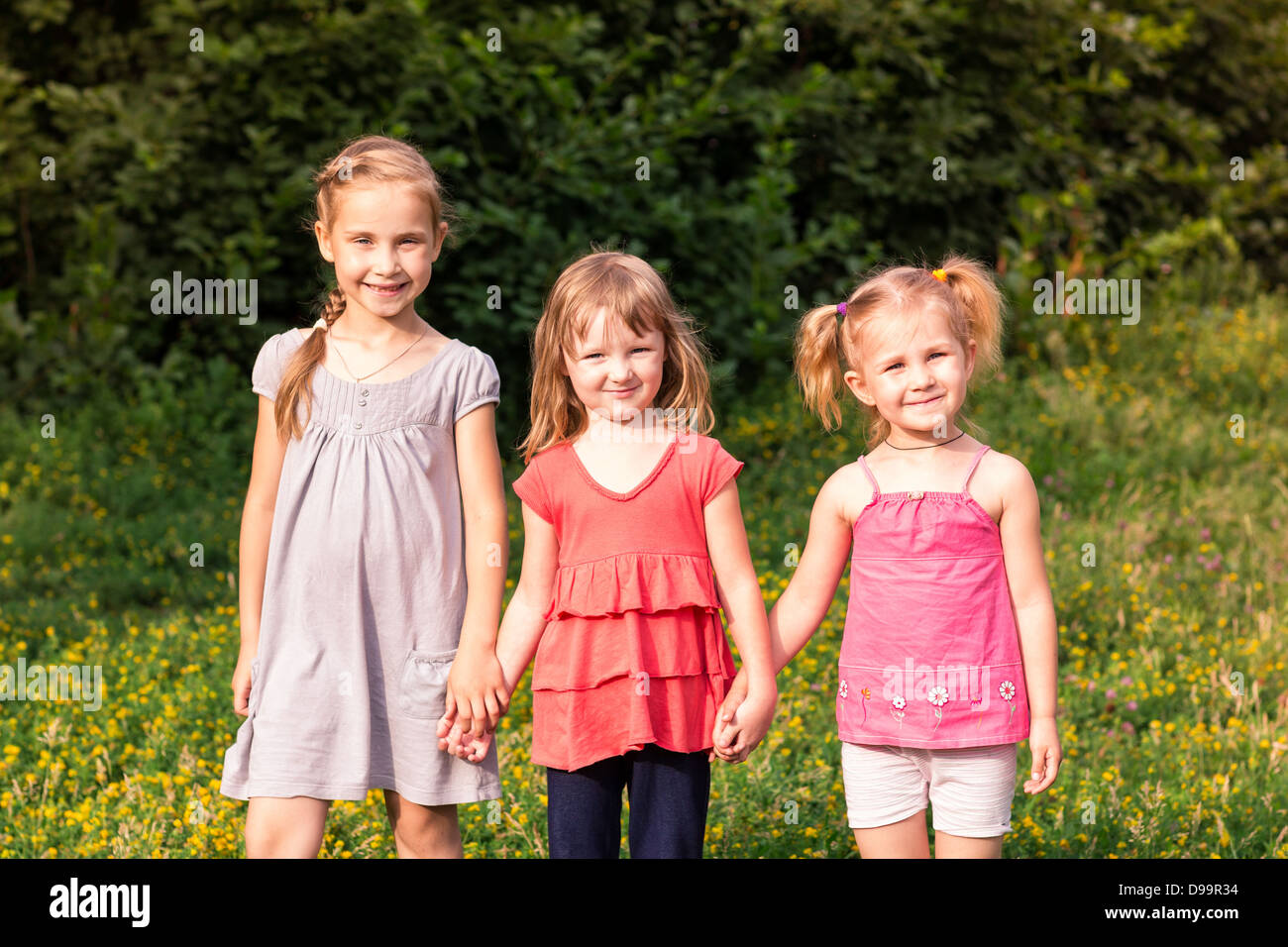 Happy smiling little kids outdoor in the park in summertime Stock Photo ...