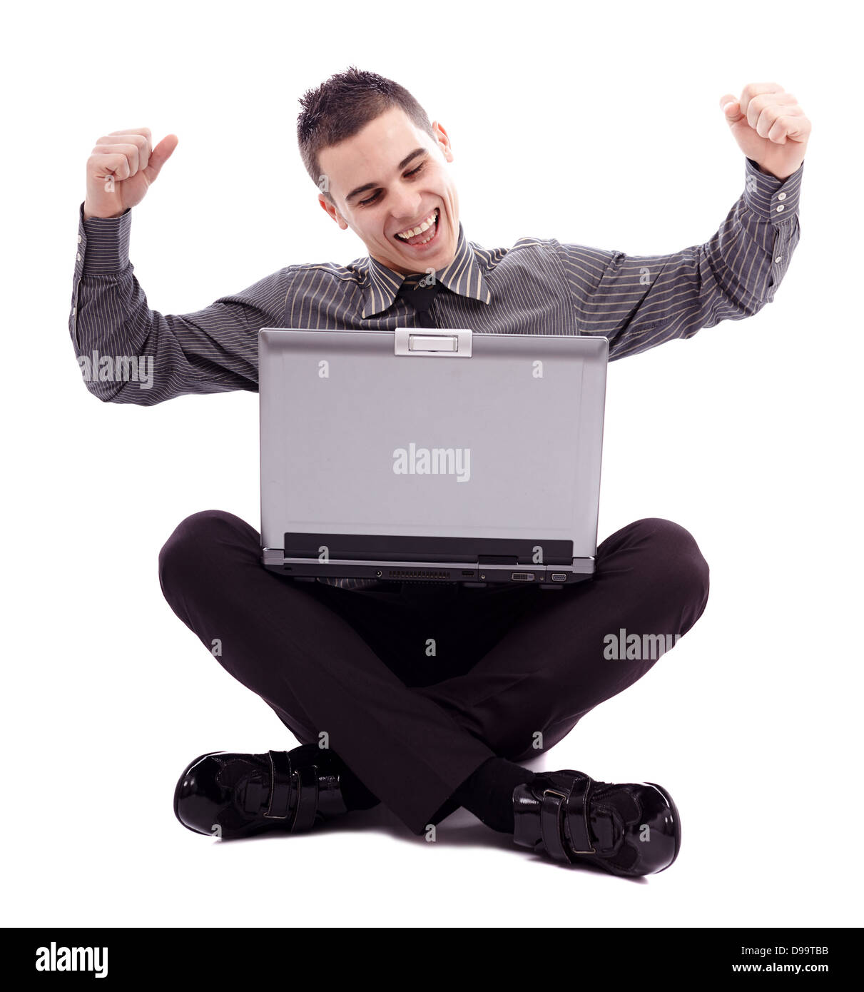 Successful young man holding his laptop on his lap, isolated on white ...