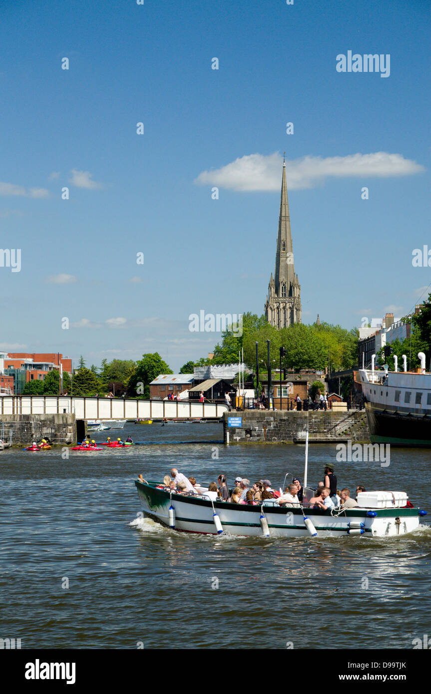 Tourist boat on floating harbour, with the spire of St Mary Redcliffe ...