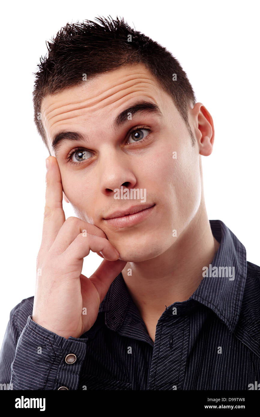 Handsome young man thinking in closeup pose, isolated on white ...