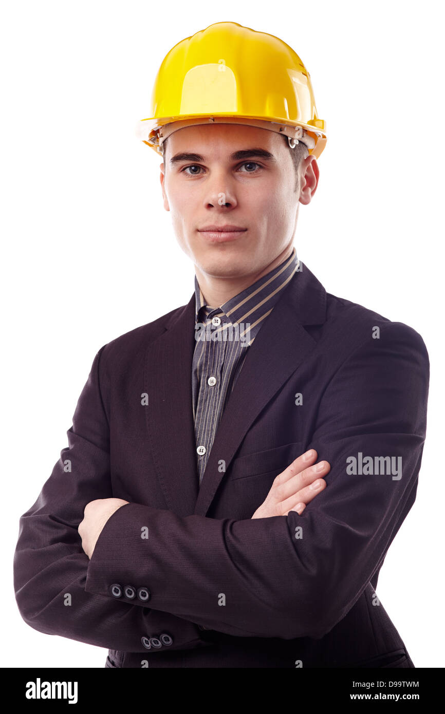 Closeup portrait of serious engineer wearing a protection helmet, arms ...