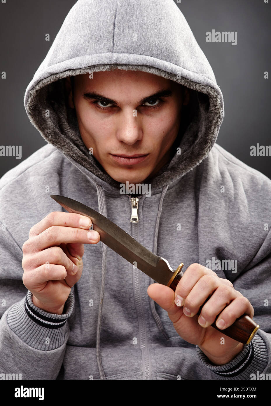 Closeup portrait of a threatening mafia man, over gray background ...