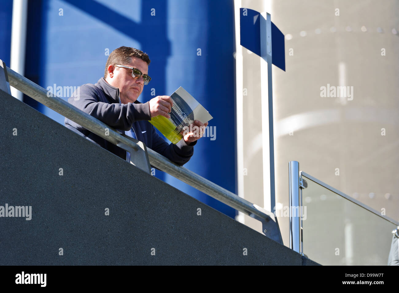 Man reading Ascot racing booklet, Ascot Racecourse, England, United ...