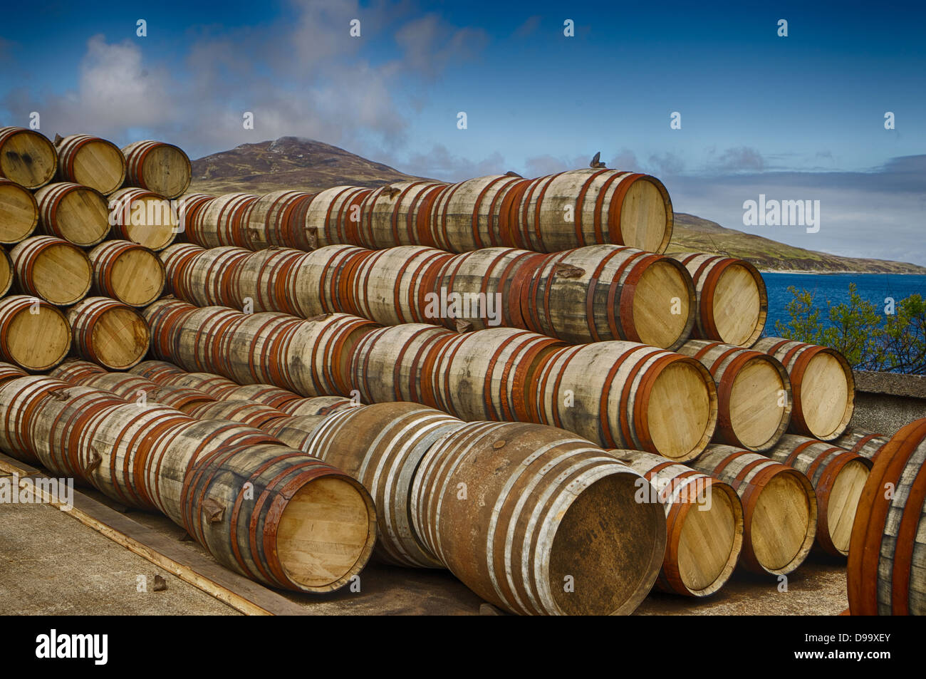 Barrels stacked awaiting to get filled with whisky Stock Photo - Alamy