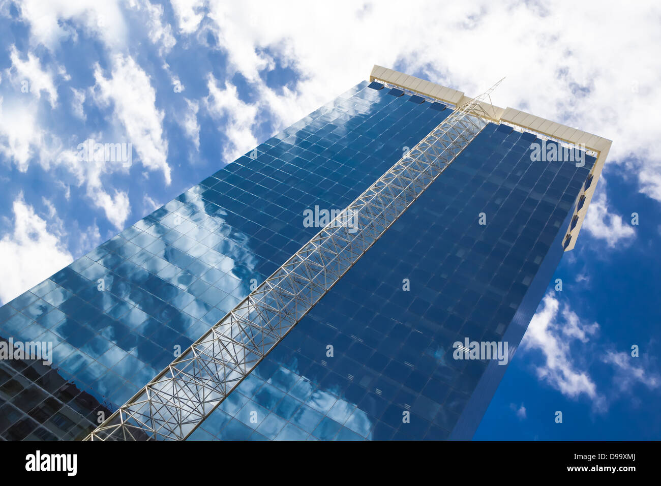 Glass skyscraper reflecting clouds in the sky Stock Photo - Alamy