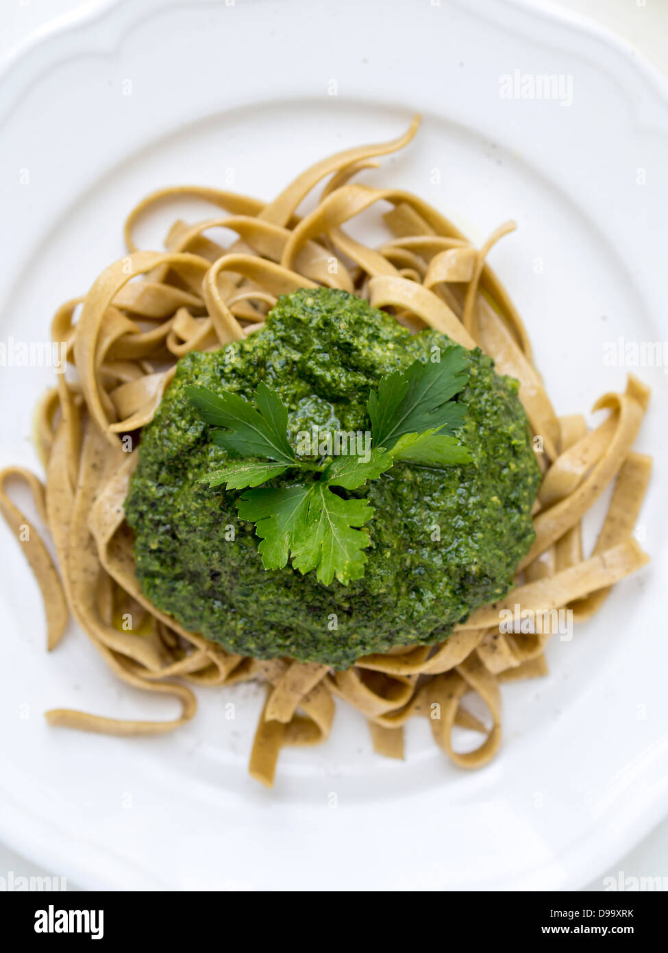 Italian cuisine: green pesto with homemade rye pasta Stock Photo - Alamy