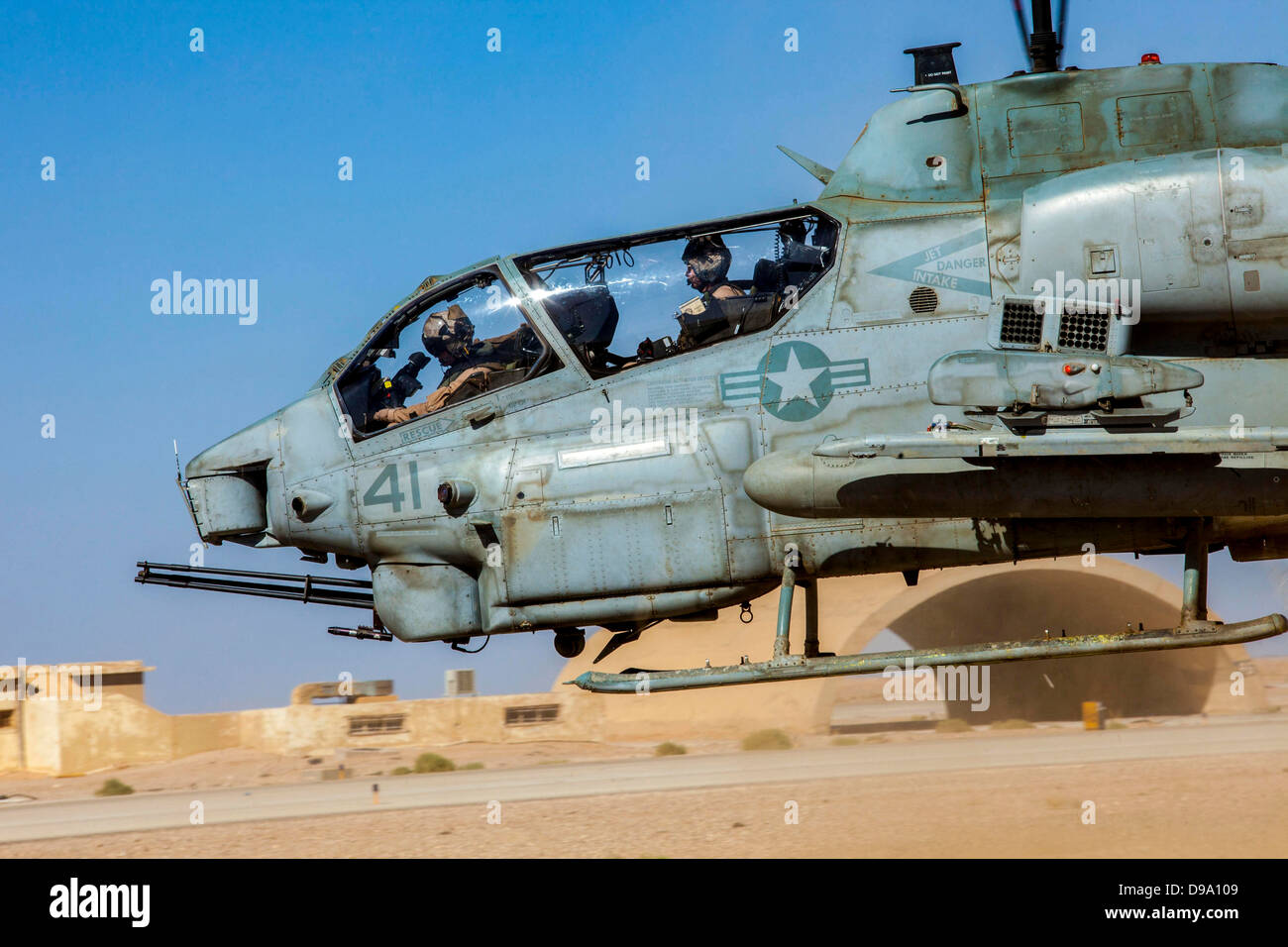 US Marine Corps AH-1W Super Cobra attack helicopter takes off during ...