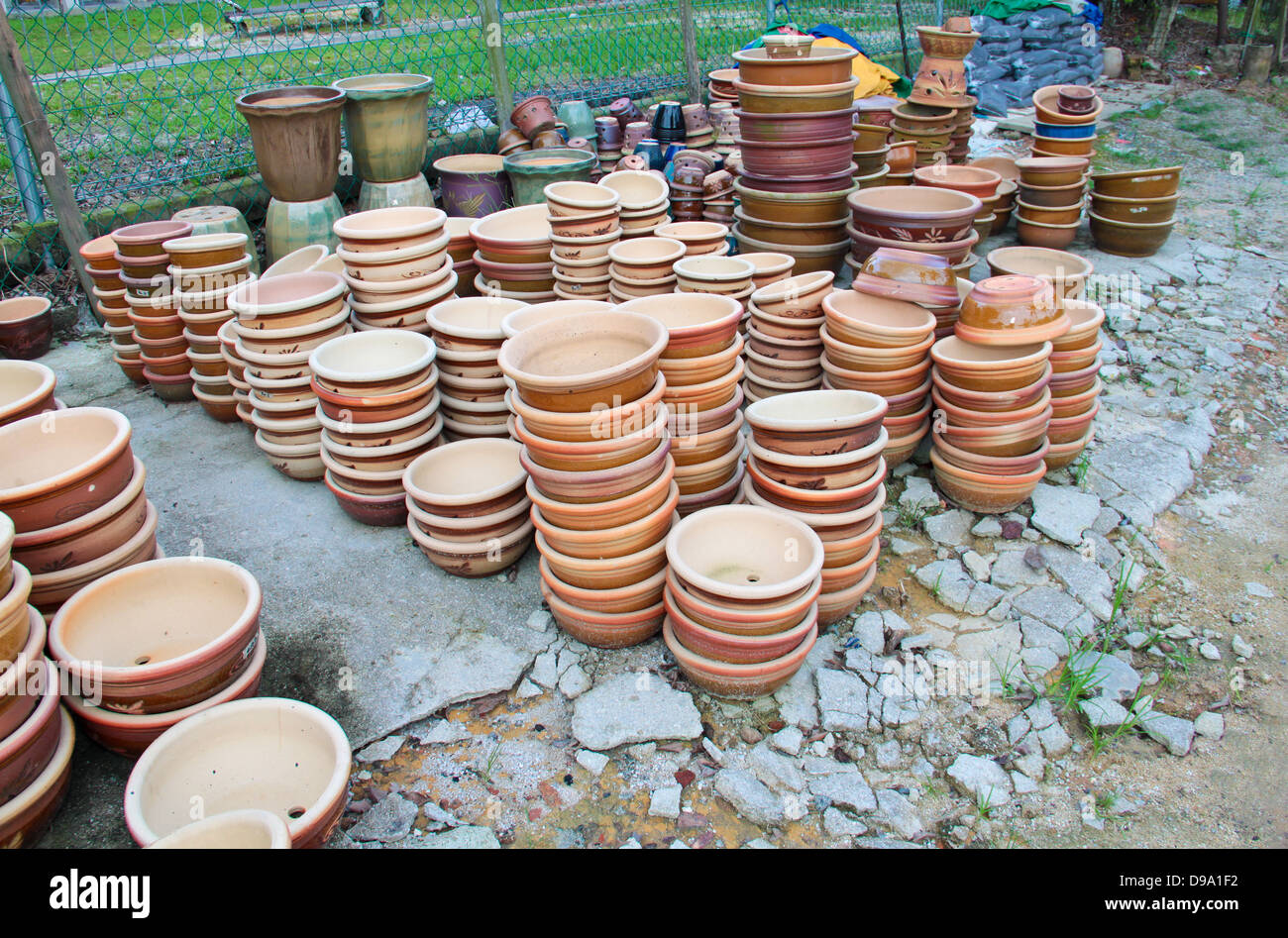 Stack of planting pots on the floor. Concept of gardening hobby Stock ...