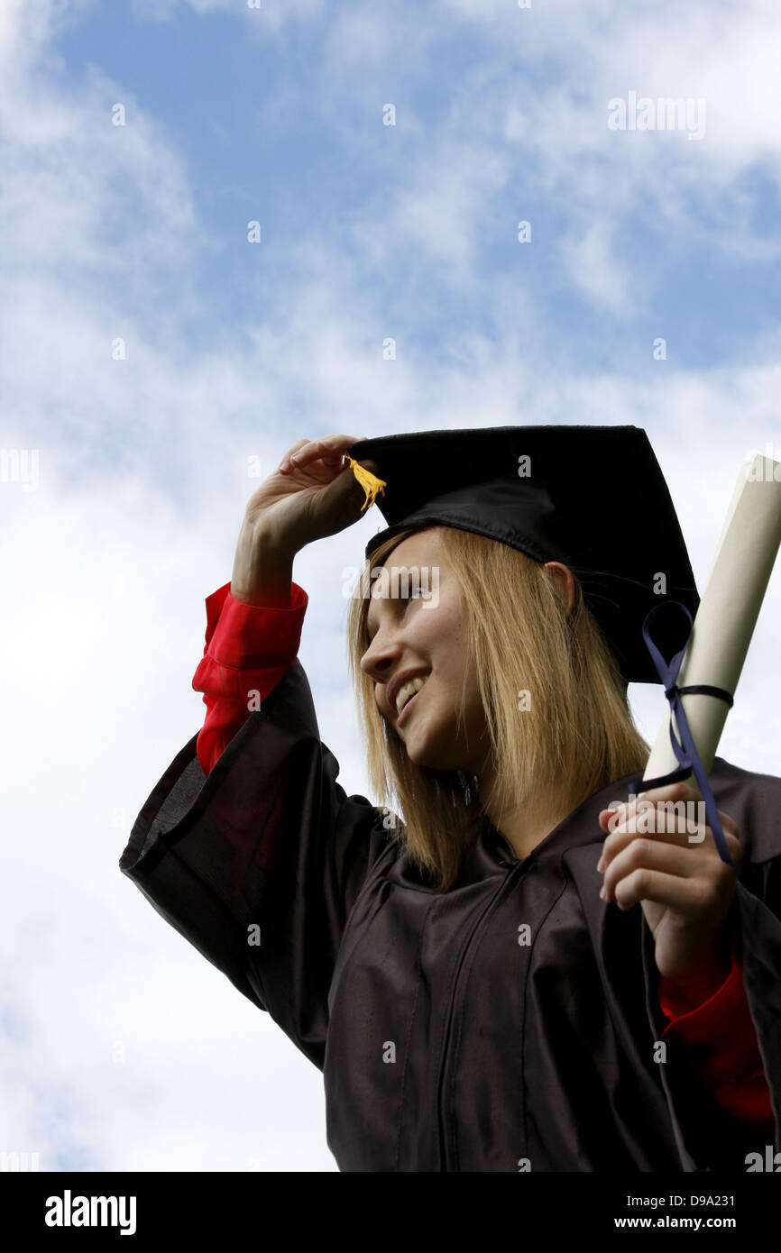 A young woman graduating with a diploma certificate Stock Photo - Alamy