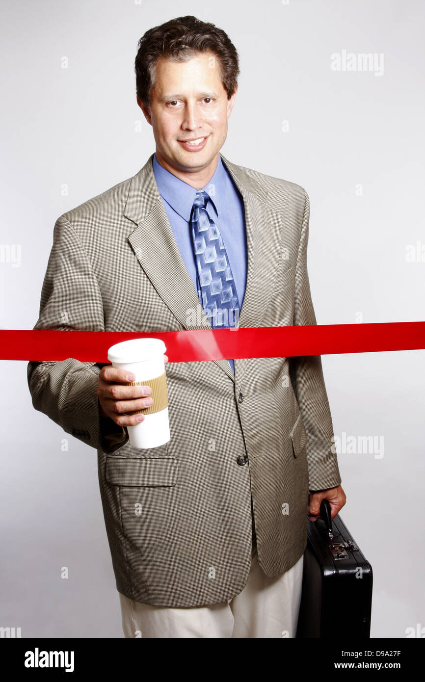 A business man at finish line or facing red tape Stock Photo - Alamy