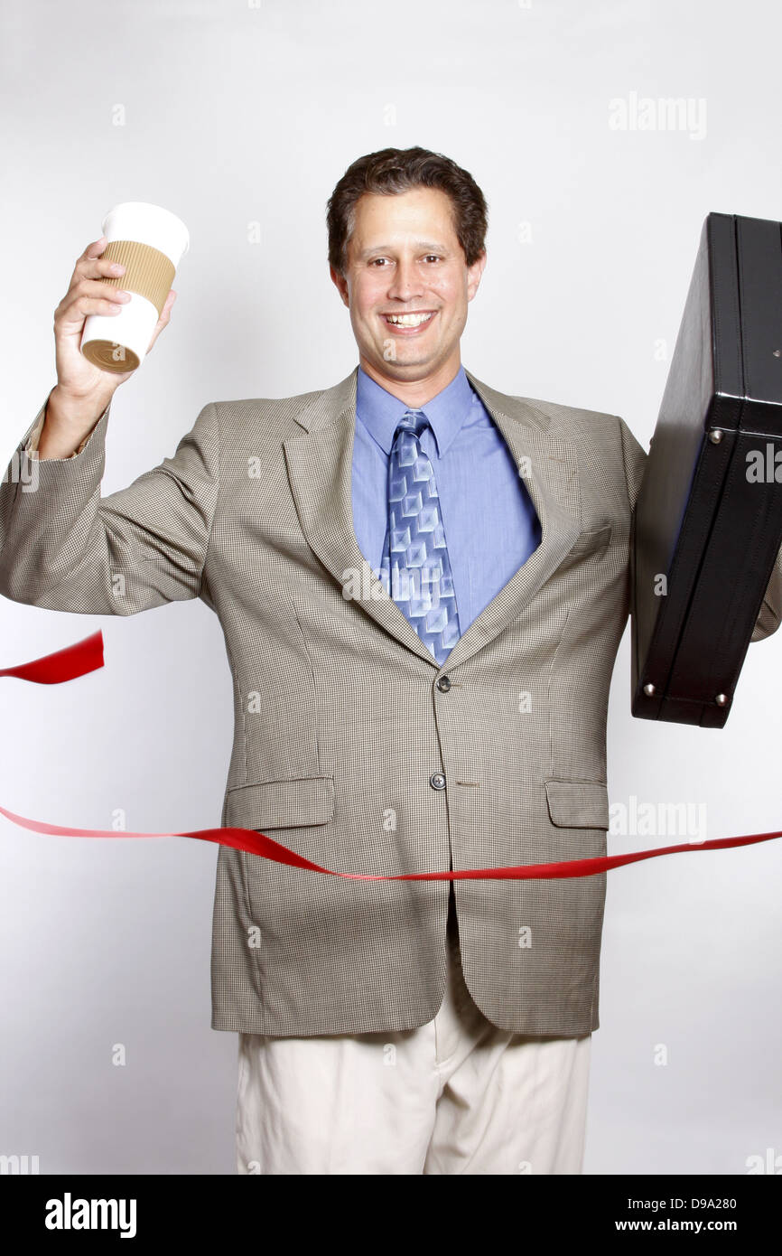 A business man crossing the finish line Stock Photo - Alamy