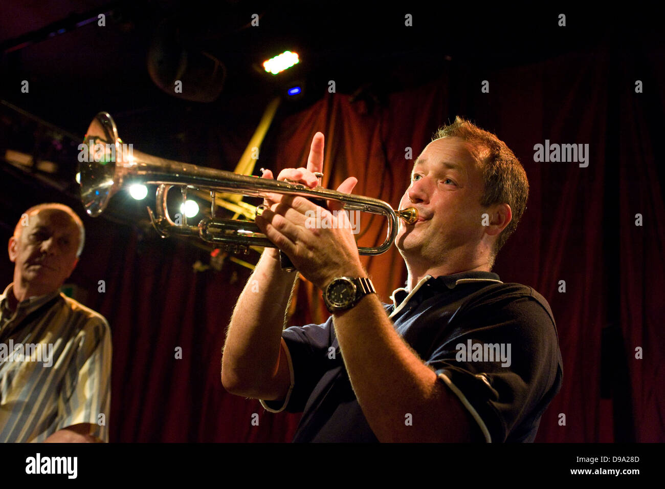 British trumpet player Mark Shepherd performing at a cellar jazz club ...