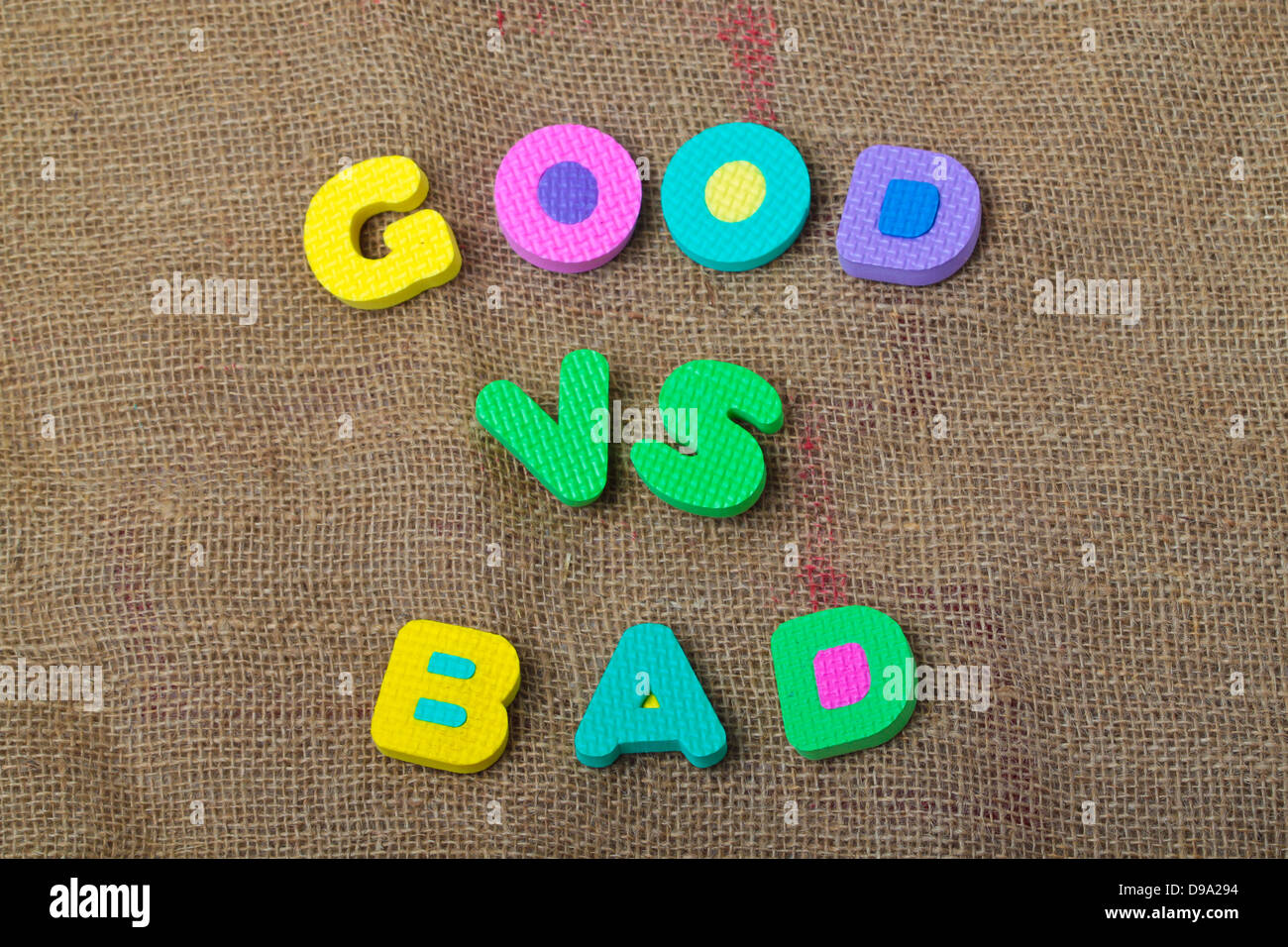 good vs bad abstract concept on gunny backdrop Stock Photo - Alamy