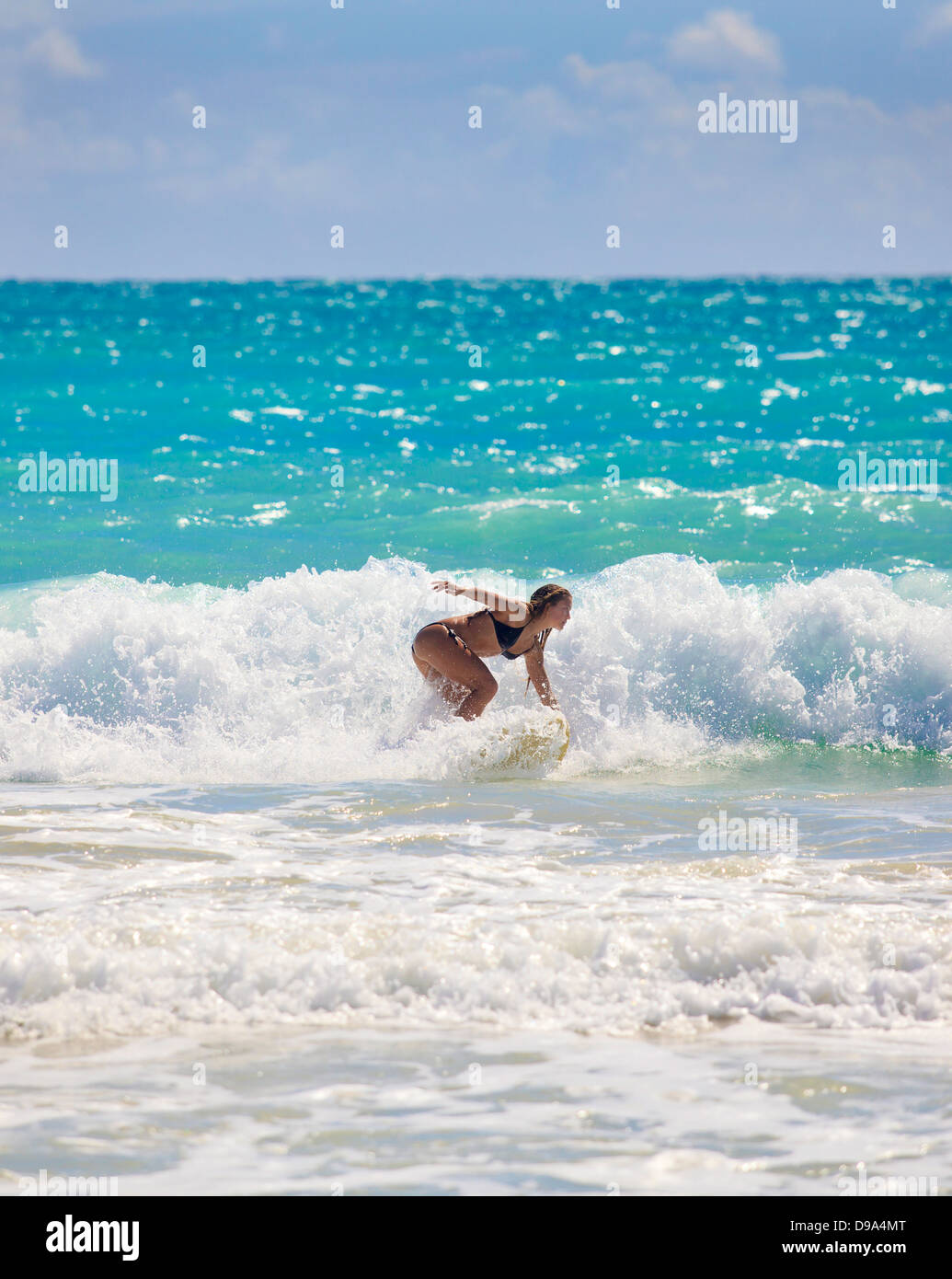 Girl surfing wave hi-res stock photography and images - Alamy