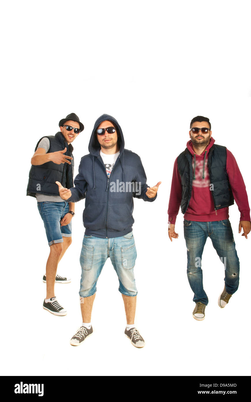 Group of three break dancers performing isolated on white background ...