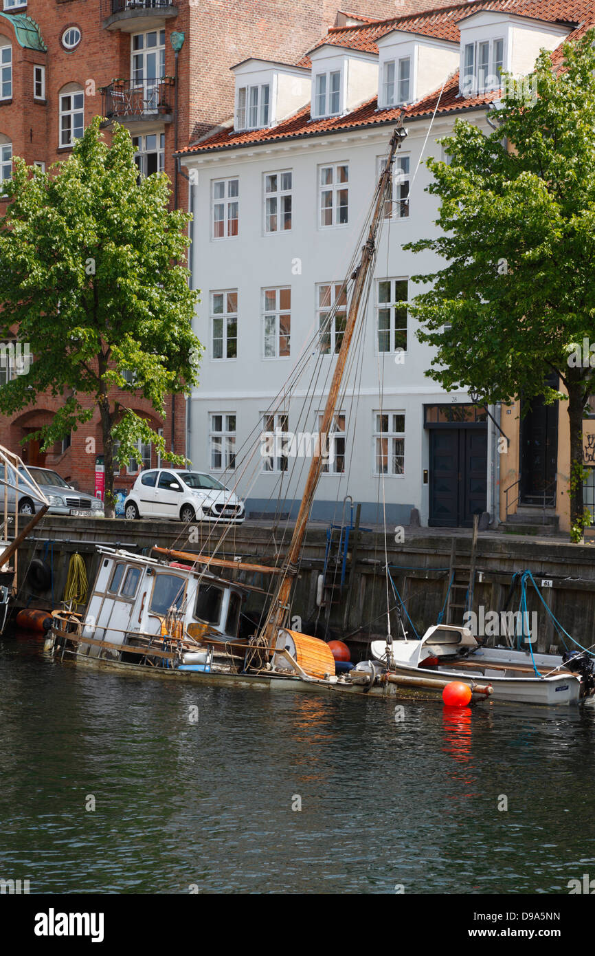 A sunken fishing boat in Christianshavn's Canal, Copenhagen, Denmark ...
