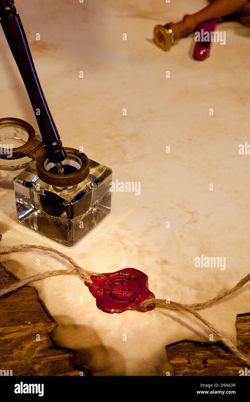 Antique ink pot on a parchment scroll with wax seal Stock Photo - Alamy