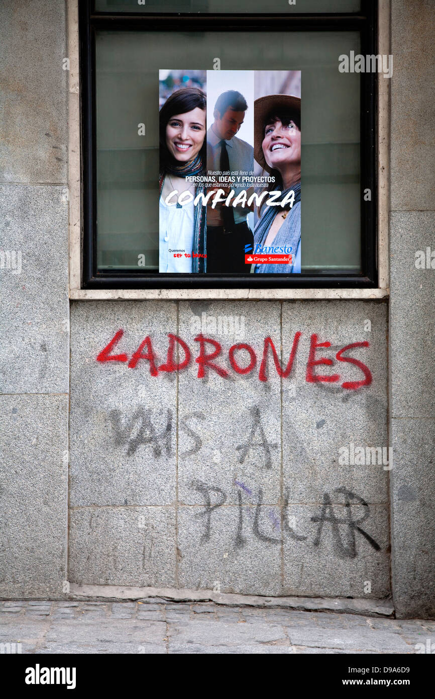 Anti banking graffiti on branch of Santander bank, Madrid , Spain Stock ...