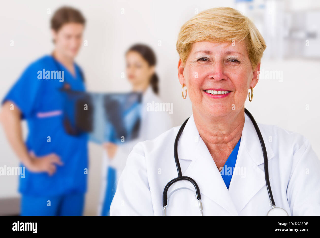 happy female senior medical worker and staff in hospital ward Stock ...