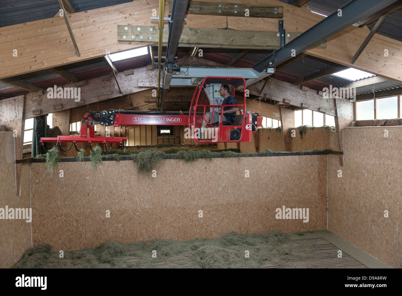 Overhead ceiling mounted crane for storage and retrieval of hay, straw ...