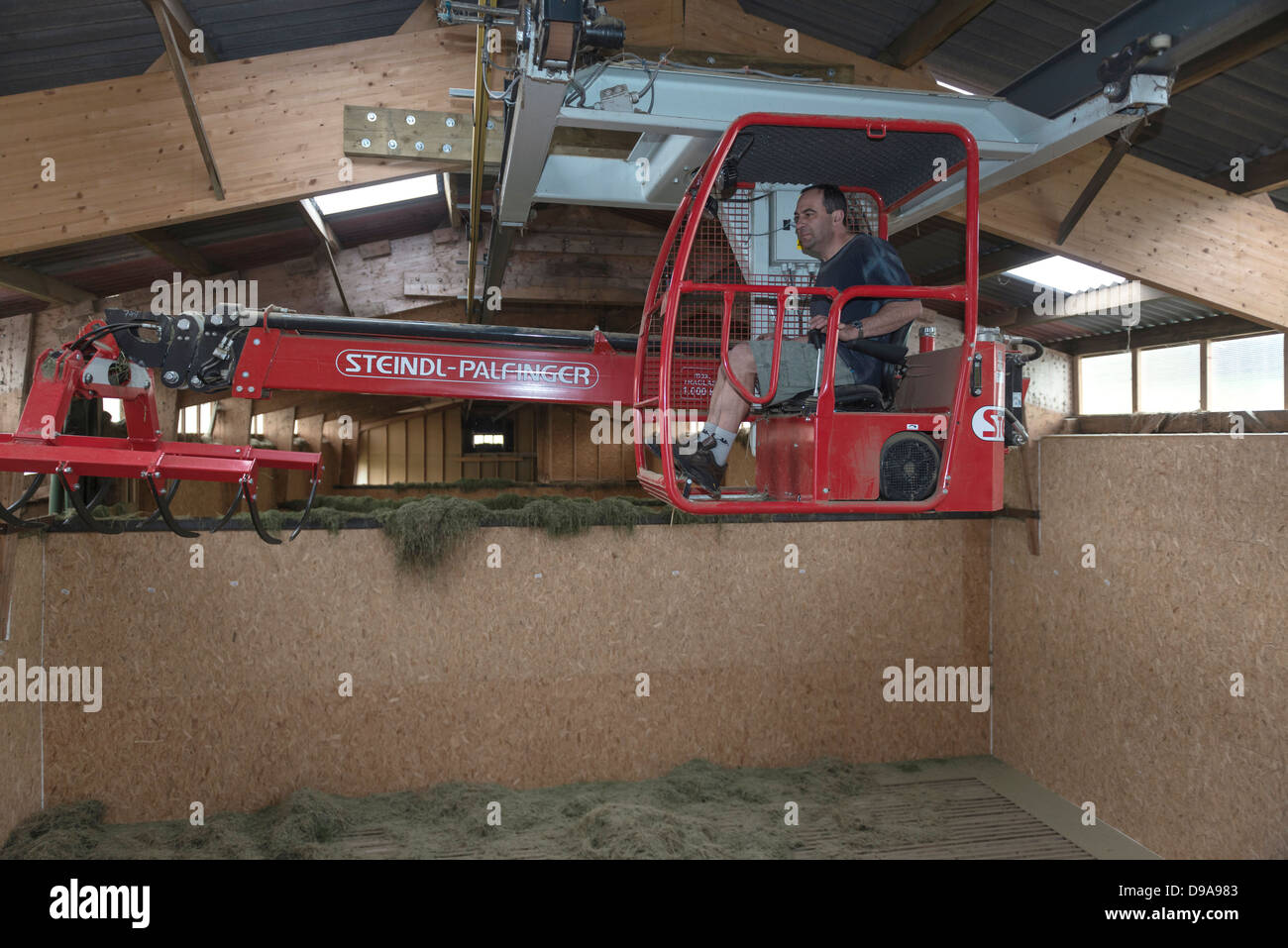 Overhead ceiling mounted crane for storage and retrieval of hay, straw ...