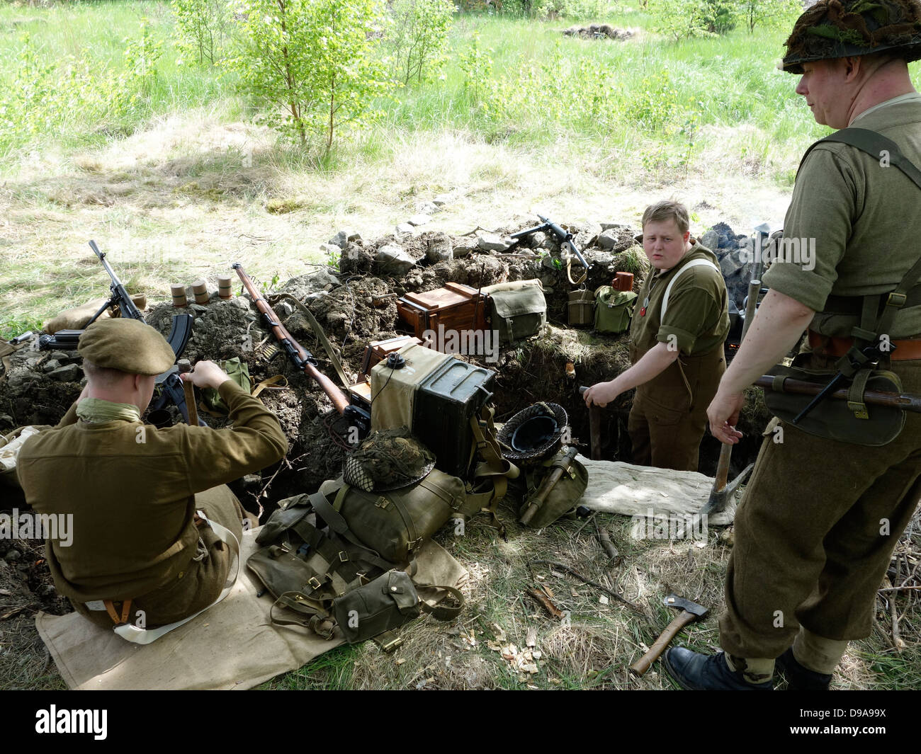 Historical re-enactment of ww2. British soldiers dig the trench Stock ...