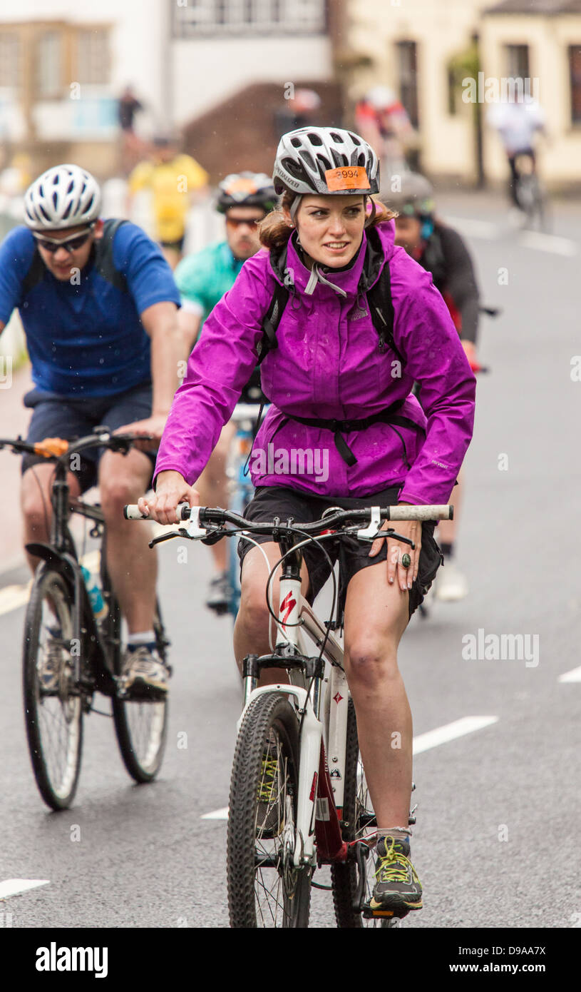 A lady cyclist going through Lindfield during the 2013 London to ...