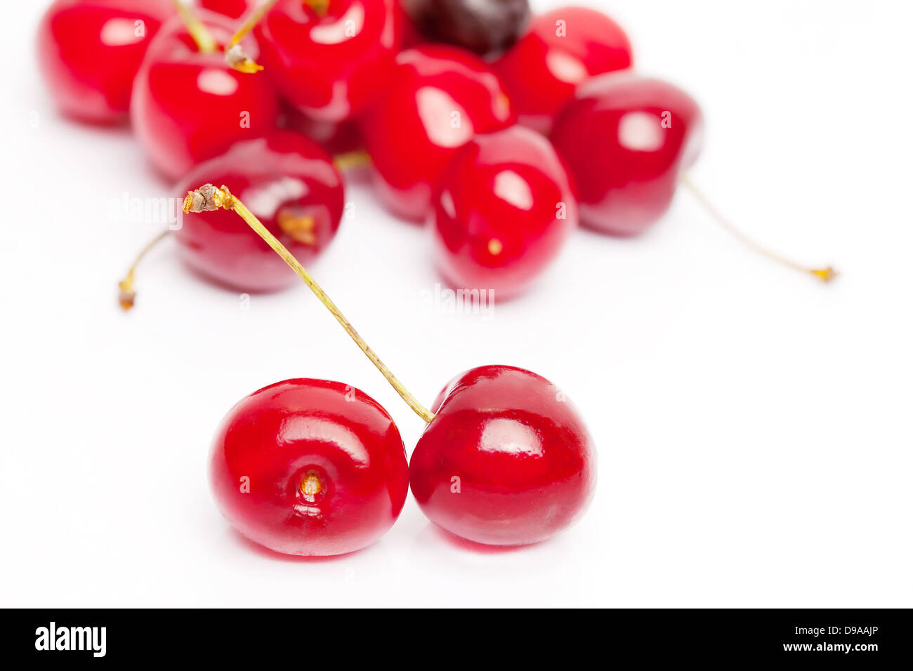 Red sweet shiny cherries on white background Stock Photo - Alamy