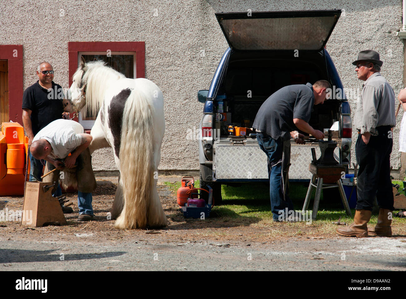 A mobile Farrier hot shoeing horses at the Appleby Horse Fair, Appleby ...