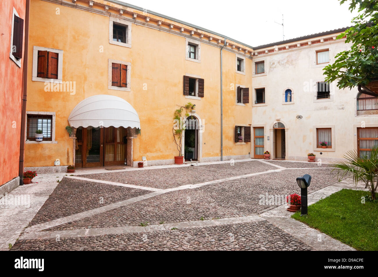 Courtyard of guesthouse, Fumane, Italy Stock Photo - Alamy