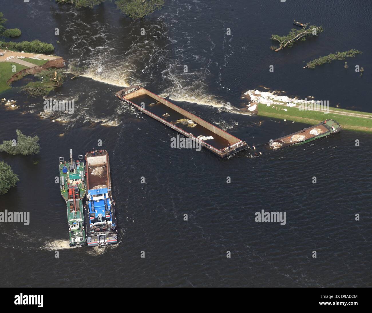 Fischbeck, Germany. 16th June, 2013. The third cargo barge is being ...