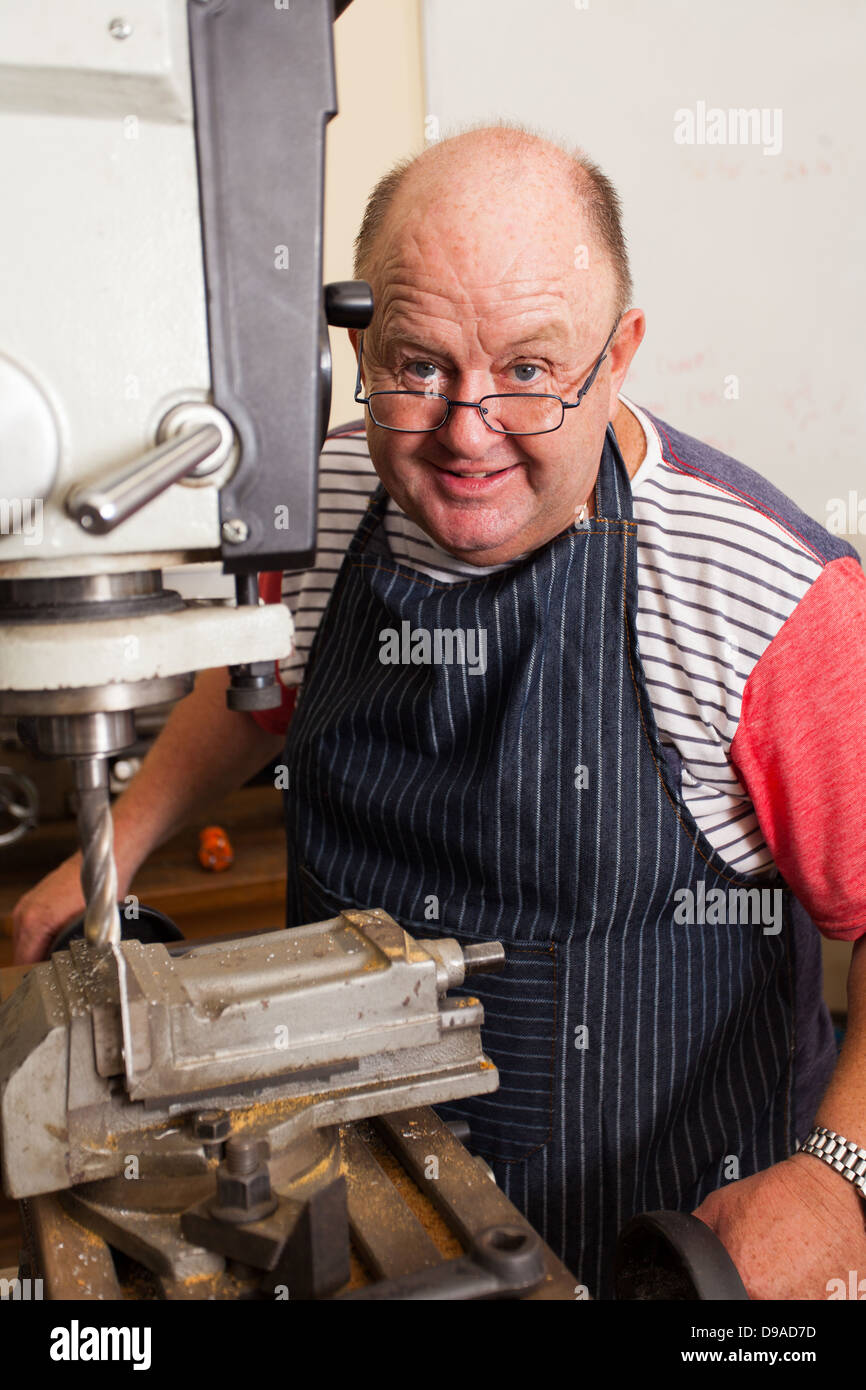 senior man operating drill press Stock Photo - Alamy