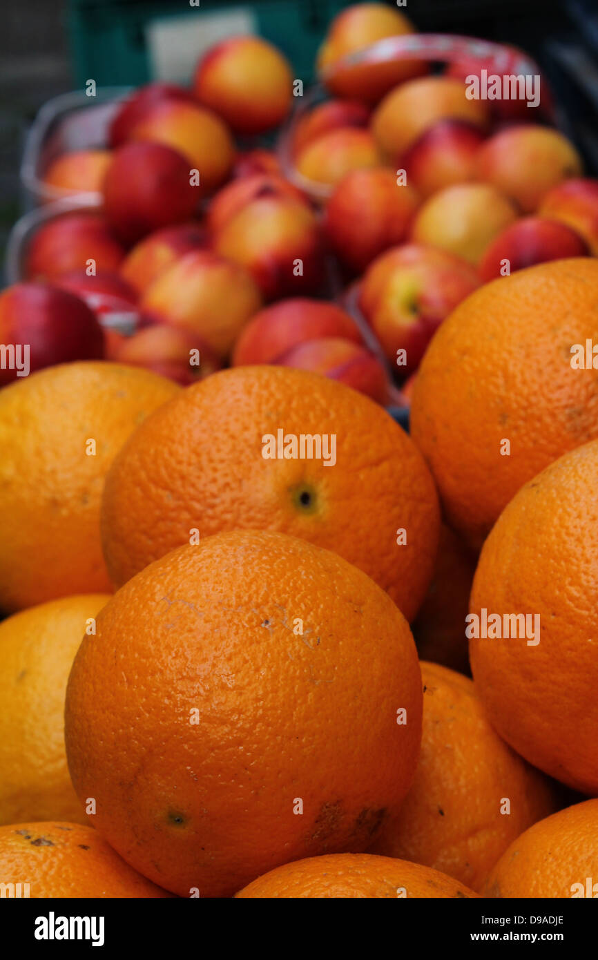 A case of mixed fruit: oranges and peaches Stock Photo - Alamy
