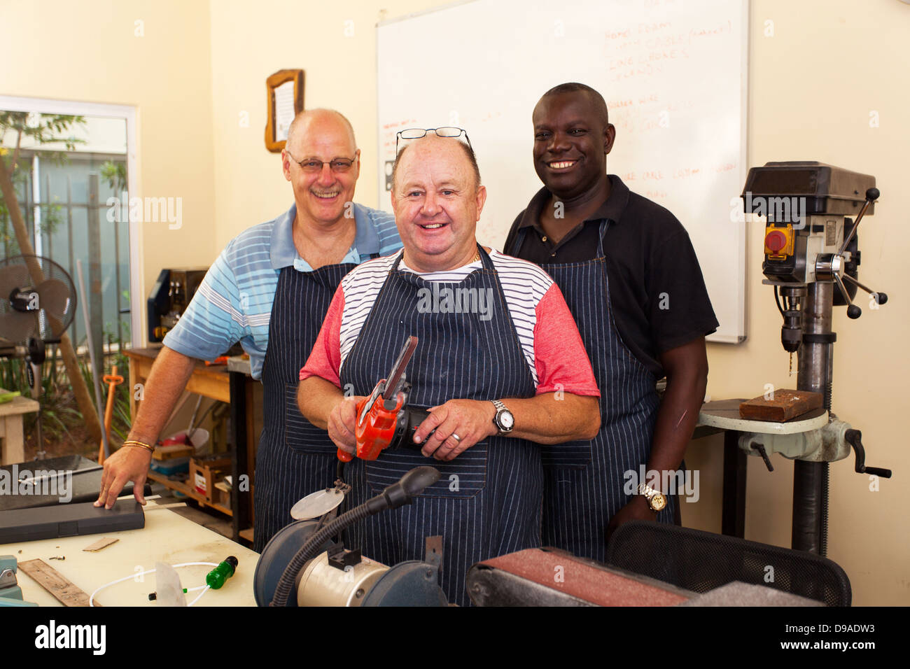 group of senior workers in workshop Stock Photo - Alamy