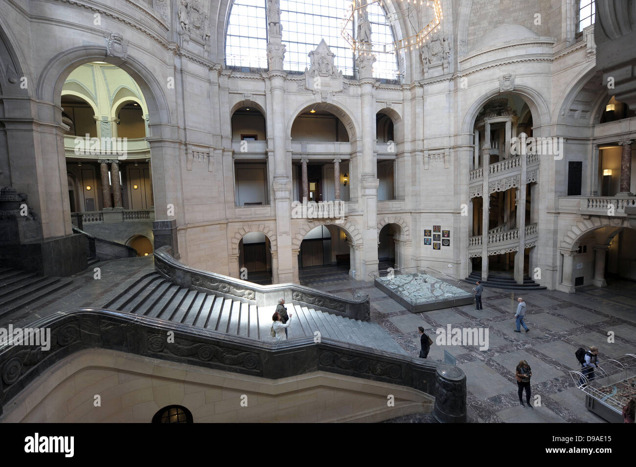 Visitor walk through the hall of the New Town Hall in Hanover, Germany ...