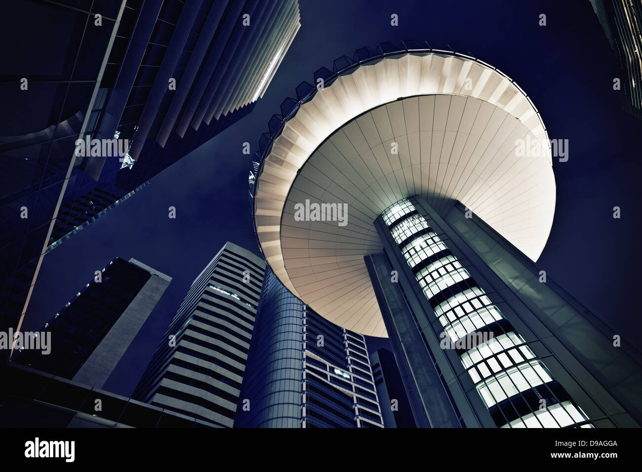 Modern futuristic office buildings exteriors at night Stock Photo - Alamy