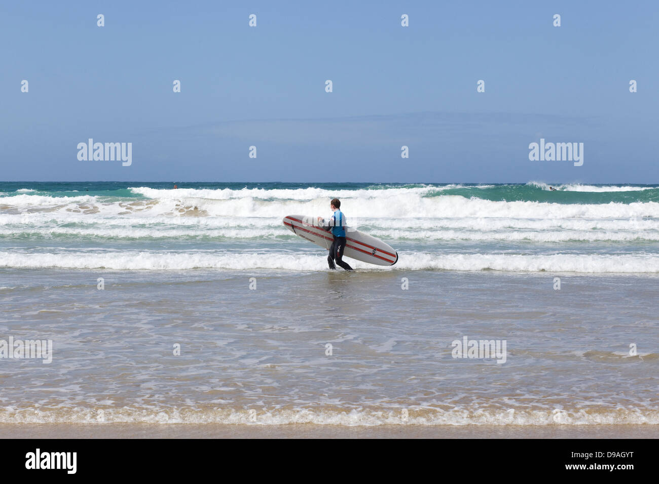 Surfers on the surf in Newquay Cornwall Stock Photo - Alamy